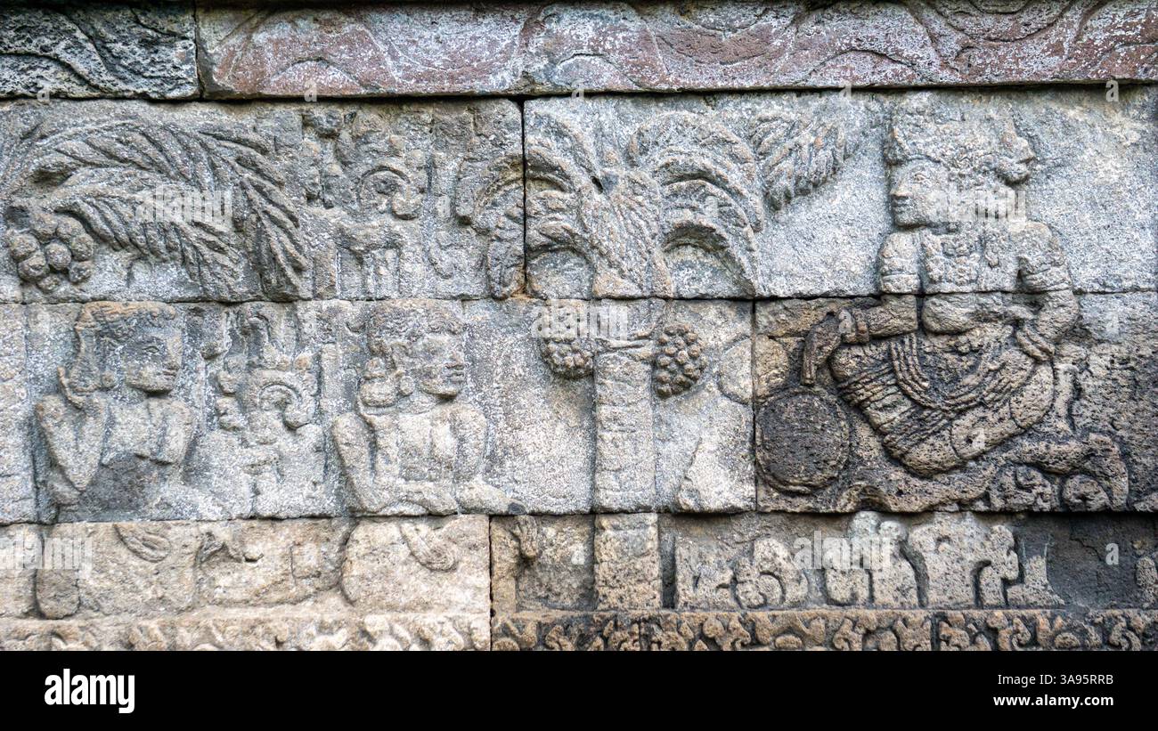 Carvings on the stone walls of Penataran temple. Penataran temple is ...