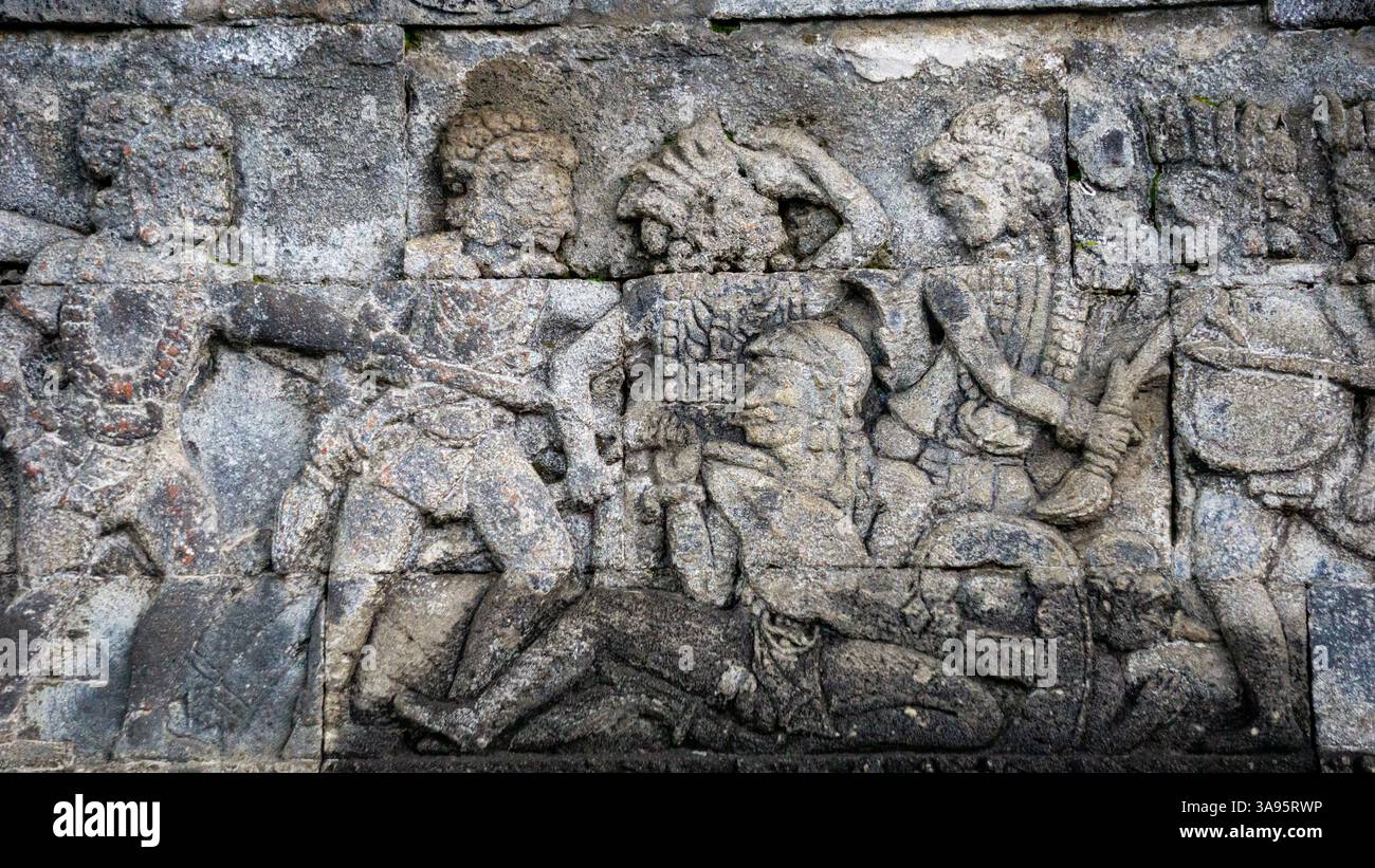 Carvings on the stone walls of Penataran temple. Penataran temple is ...