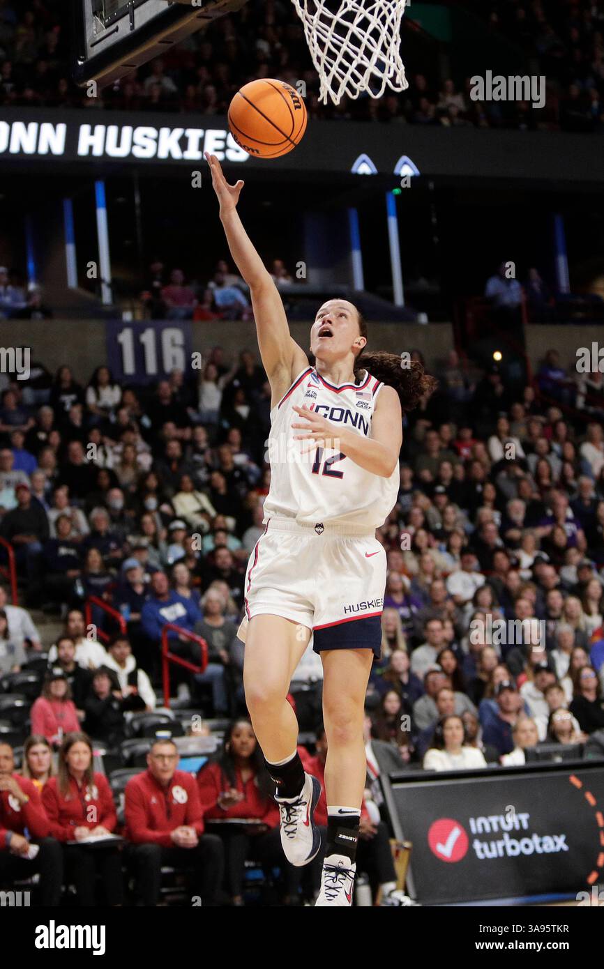 UConn guard Ashlynn Shade (12) shoots during the first half against ...