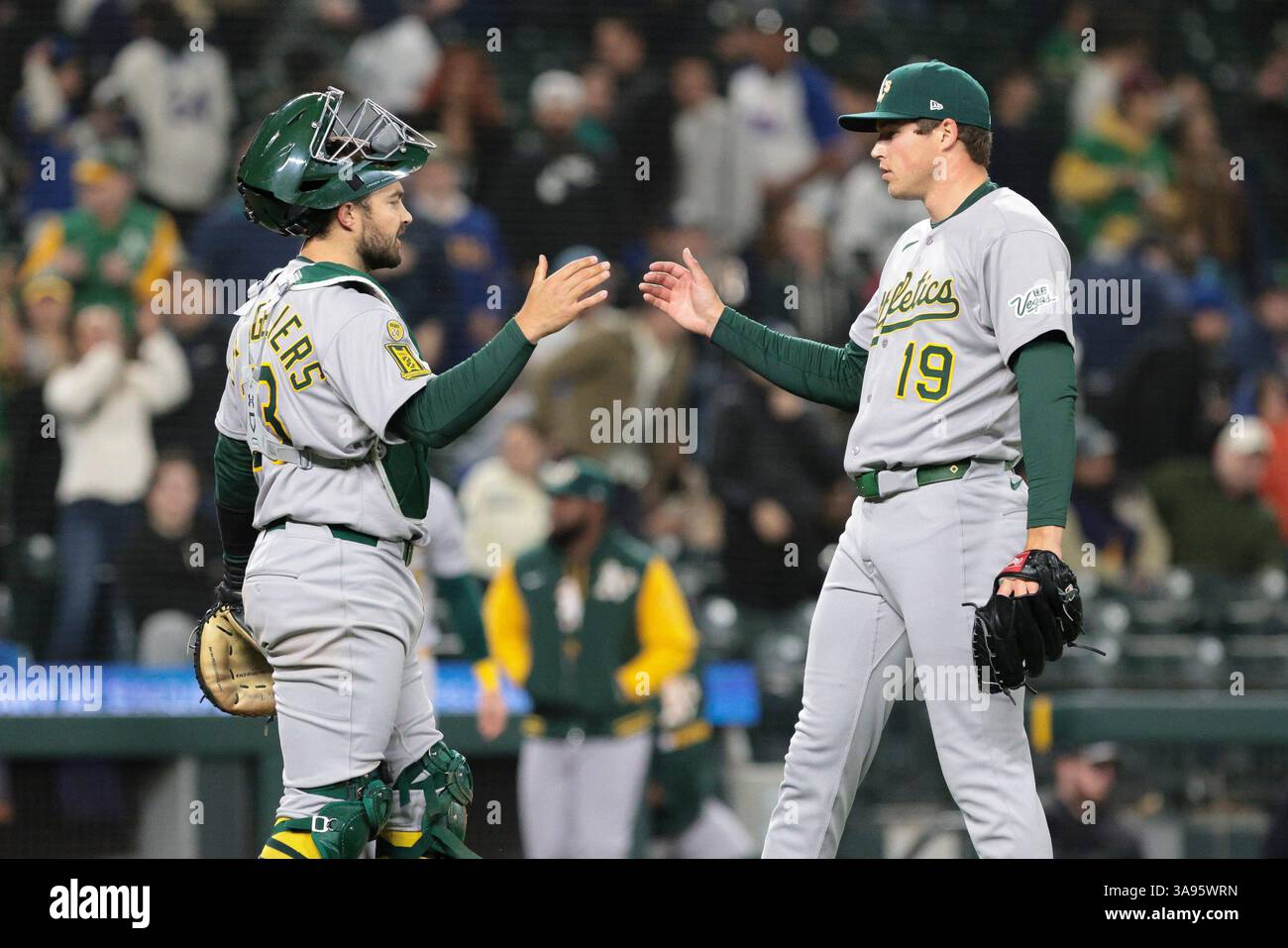Athletics catcher Shea Langeliers, left, celebrates with closing ...
