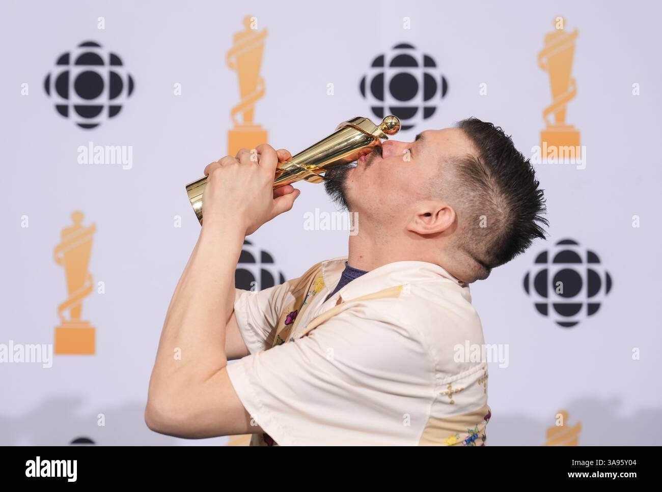 Vancouver, Canada. 29th Mar, 2025. A member of the Black Bear Singers ...