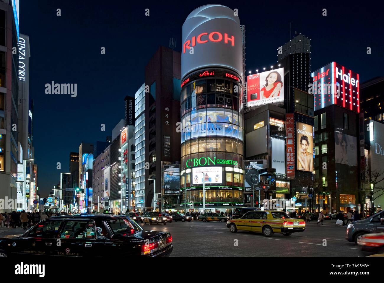 Night view of busy intersection of Chuo-dori and Harumi-dori streets in ...