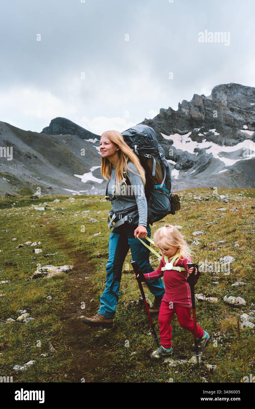 Family hiking in mountains mother with child traveling active adventure ...