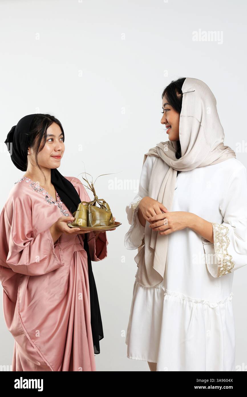 Two Friends Celebration Idul Fitri Or Eid Mubarak with Ketupat ...