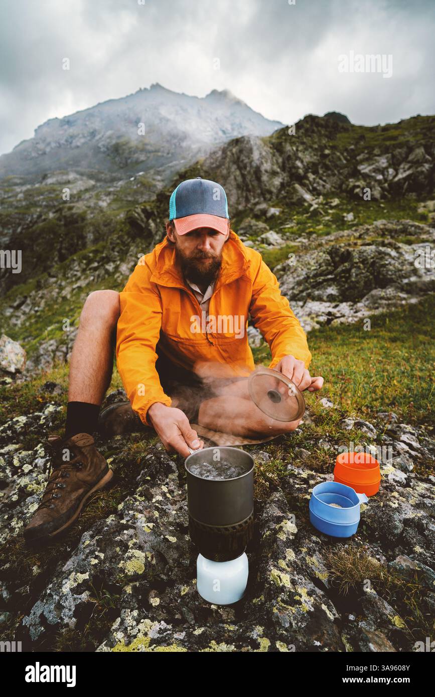 Man cooking camping meals hi-res stock photography and images - Alamy