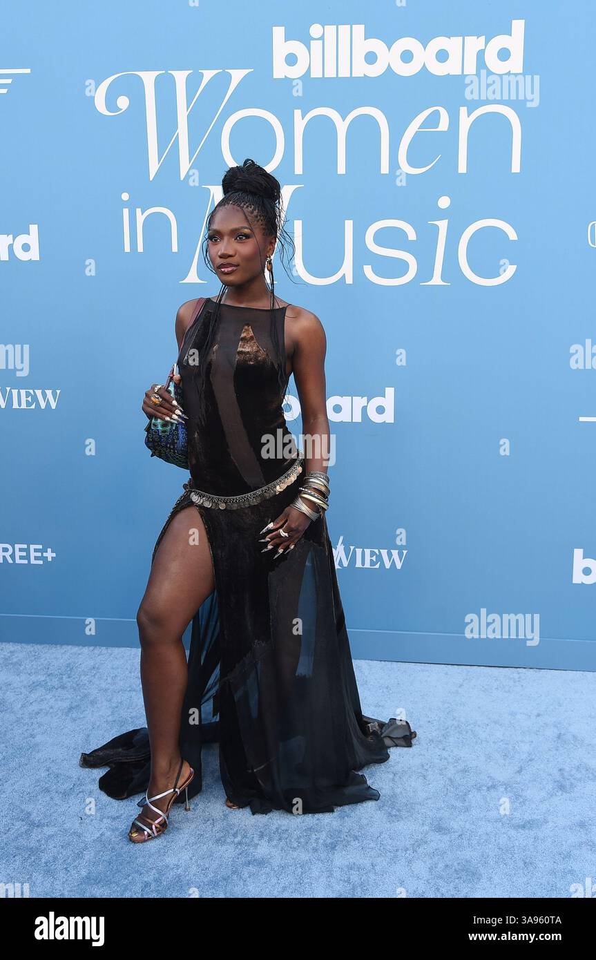 Doechii arrives at the Billboard Women in Music Awards on Saturday ...