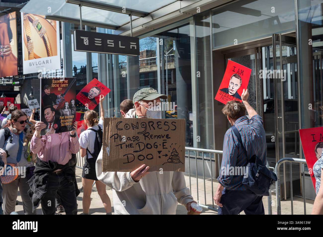 Protesters block an entrance to the Manhattan Tesla showroom during a ...
