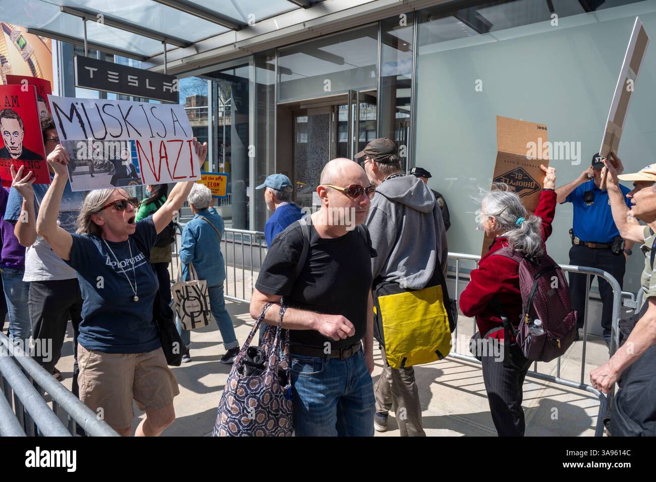 New York, United States. 29th Mar, 2025. Protesters block an entrance ...