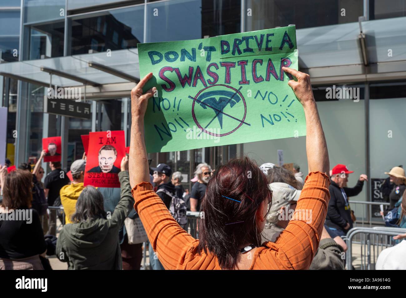 New York, United States. 29th Mar, 2025. A protester holds a placard ...