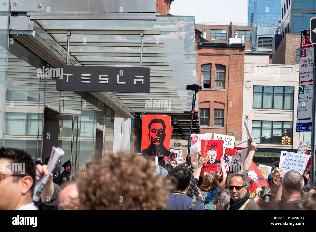 New York, United States. 29th Mar, 2025. Protesters block an entrance ...