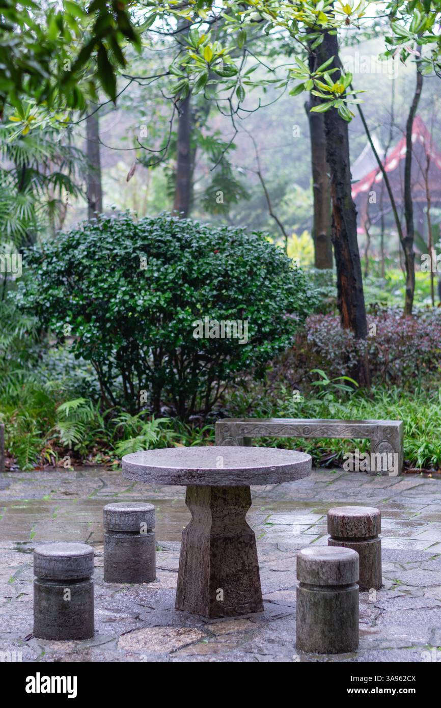 Zen Garden Oasis: Stone Table and Stools Nestled Among Lush Greenery ...