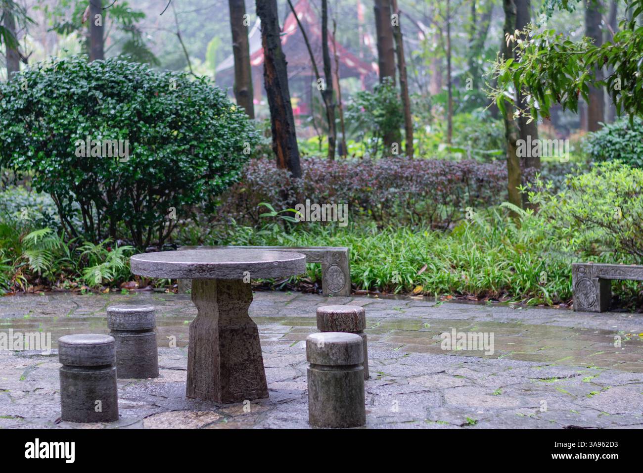 Zen Garden Oasis: Stone Table and Stools Nestled Among Lush Greenery ...