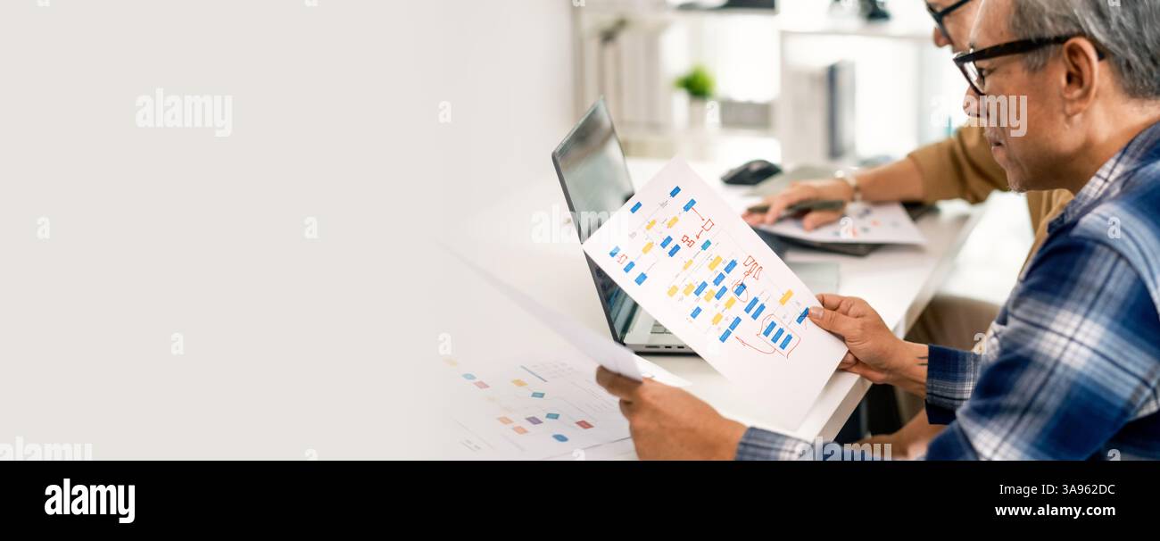 Group of asian senior in a collaborative software development analyzing ...