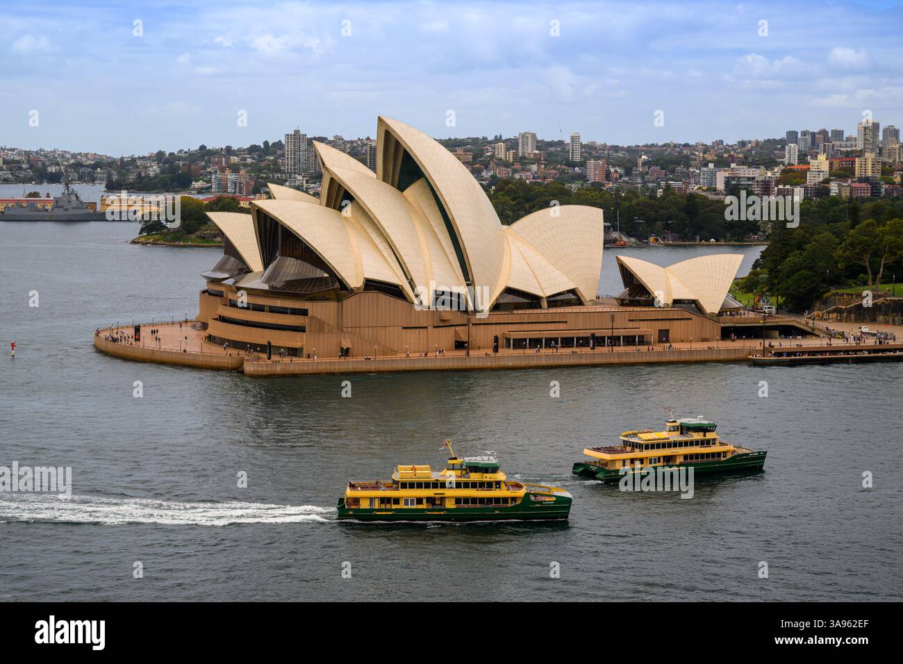 Looking down on the Sydney Opera House with two Sydney Harbour Ferries ...