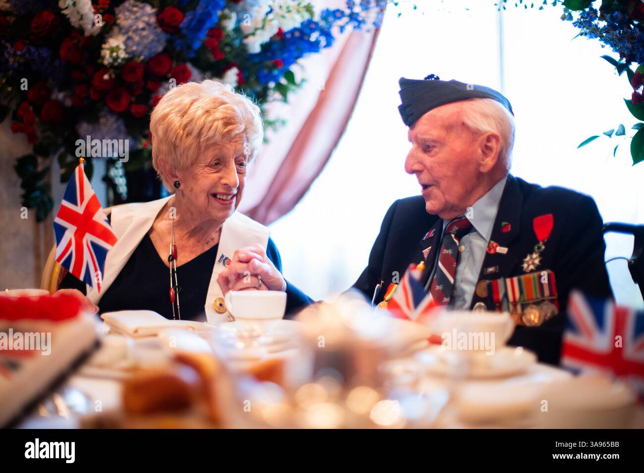 Ruth Bourne, 98 and Bernard Morgan, 100, hold hands as they join Second ...