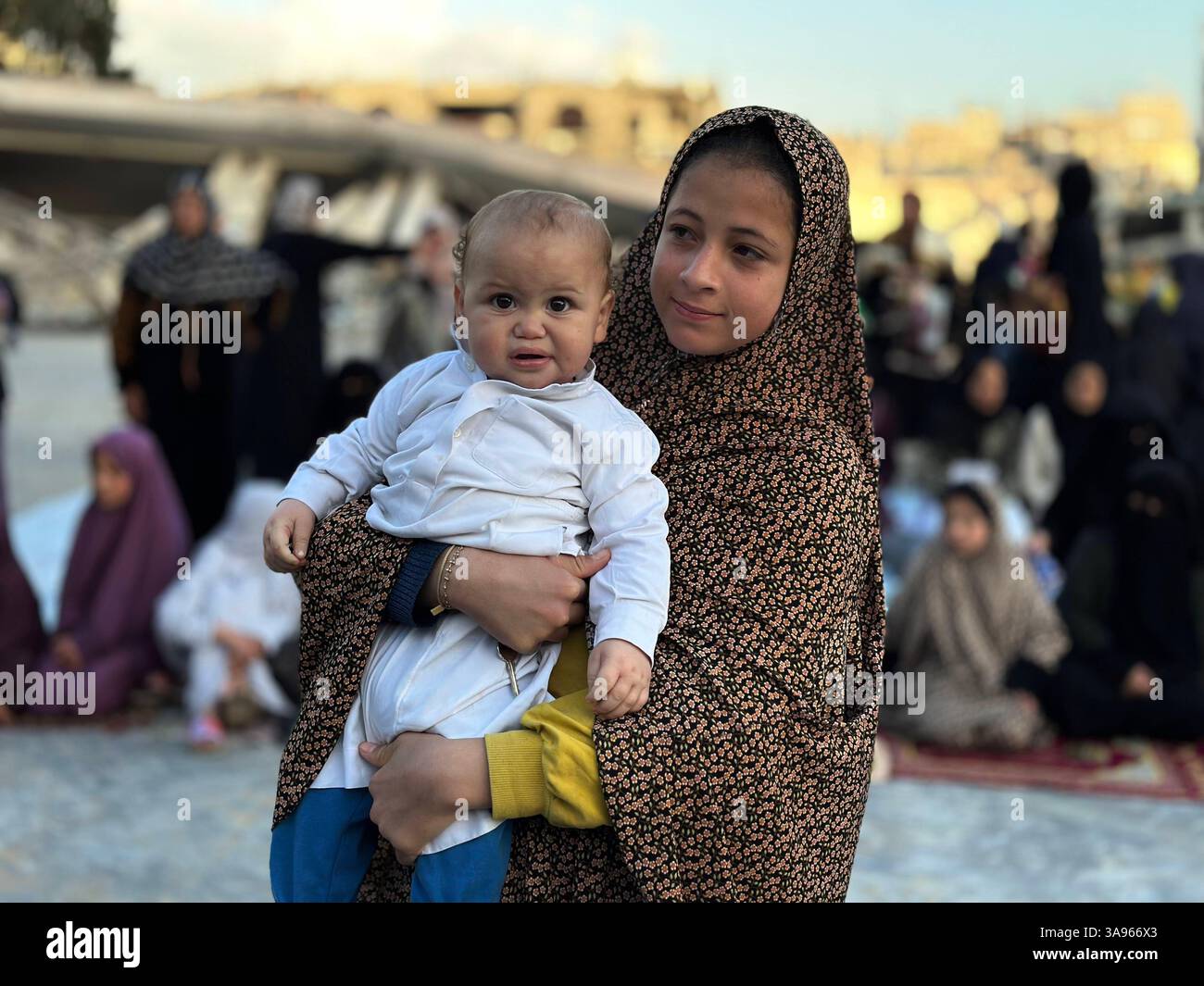 Palestinian Muslims attend Eid al-Fitr prayer marking the end of the ...