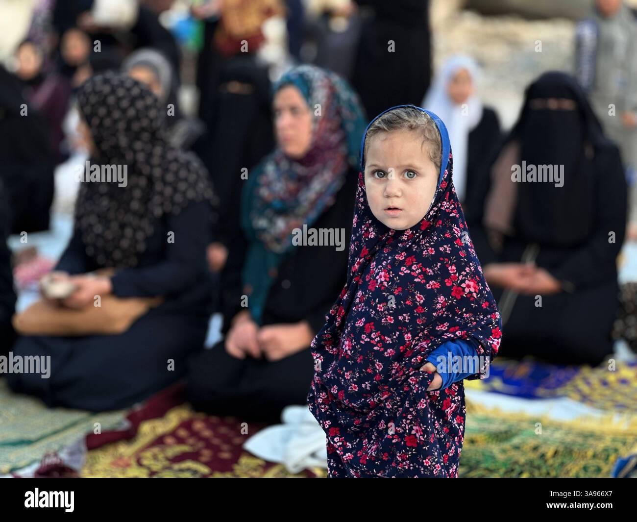 Palestinian Muslims attend Eid al-Fitr prayer marking the end of the ...
