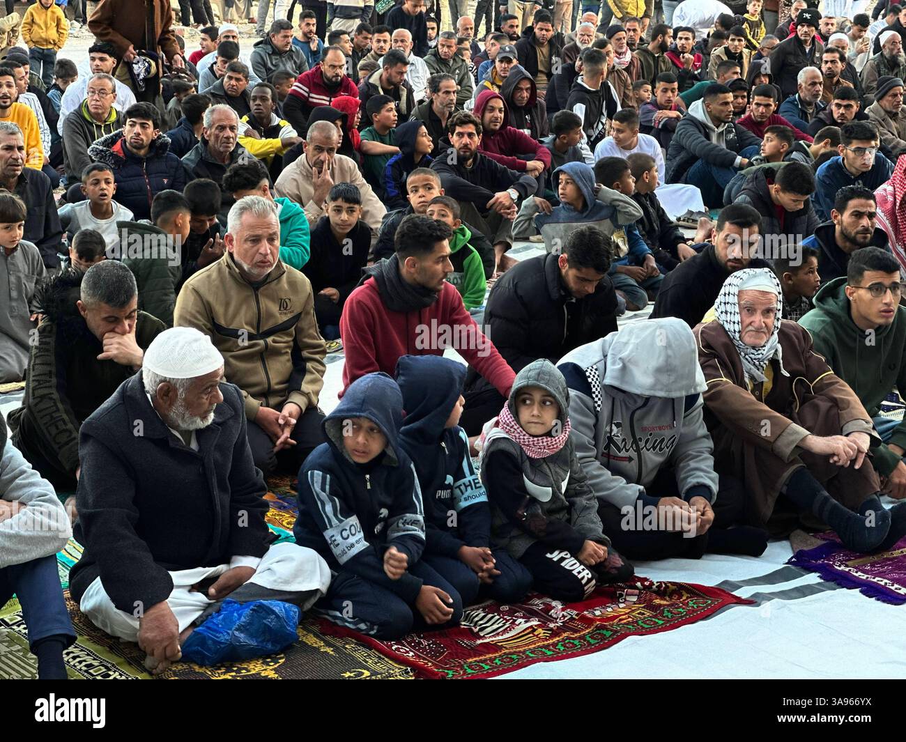 Palestinian Muslims attend Eid al-Fitr prayer marking the end of the ...