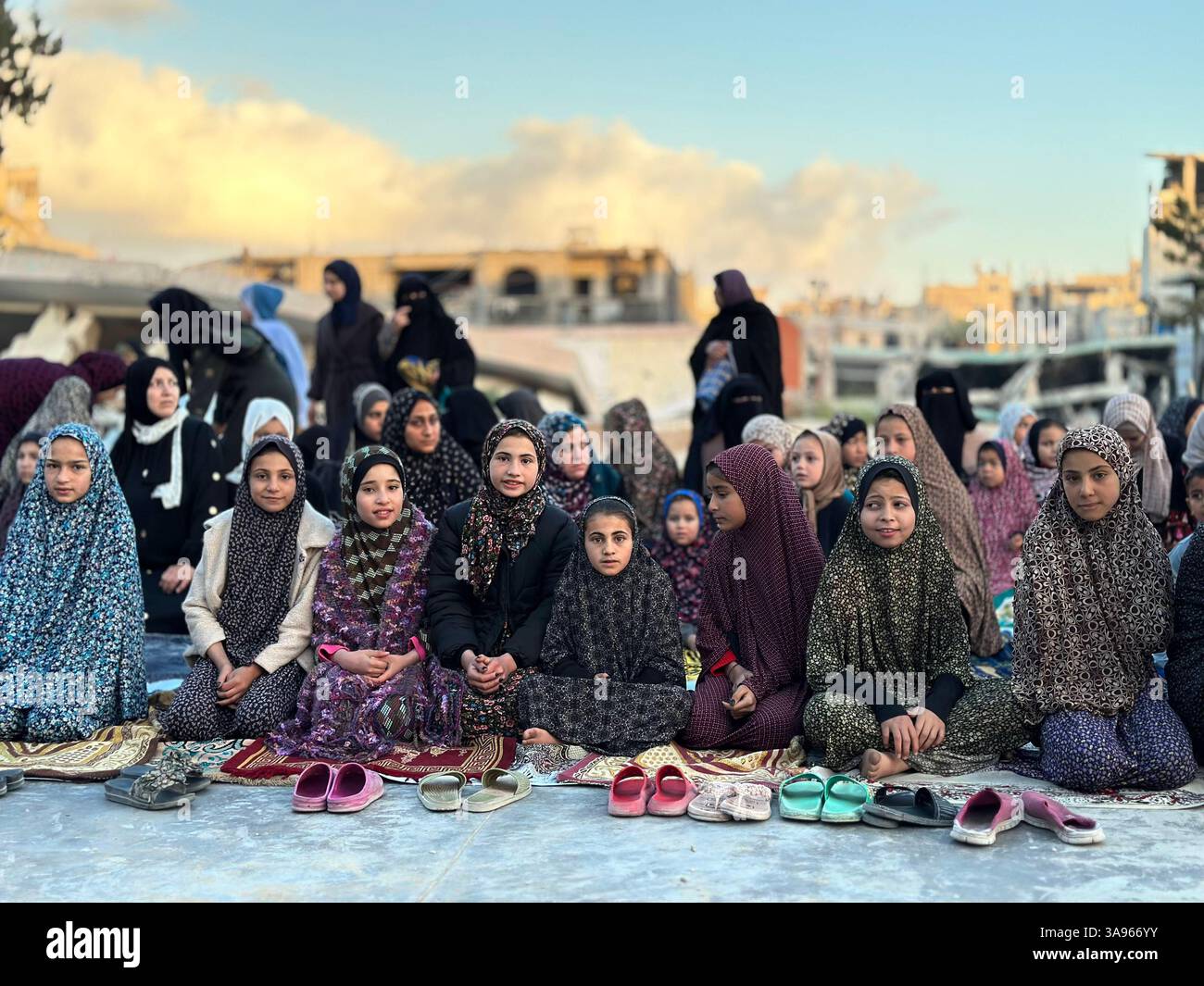 Palestinian Muslims attend Eid al-Fitr prayer marking the end of the ...