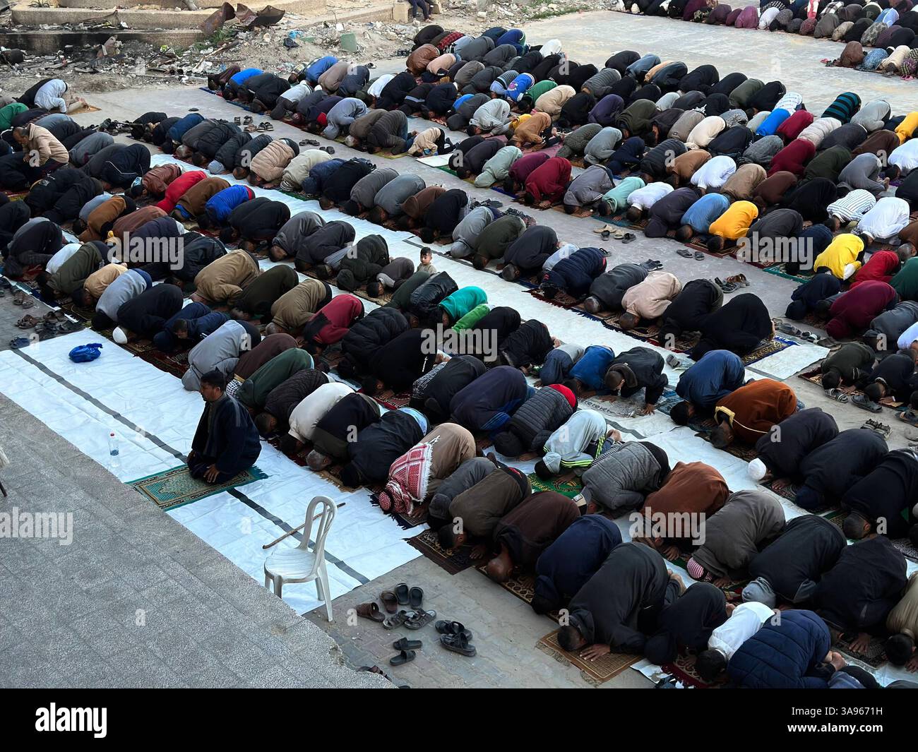Palestinian Muslims attend Eid al-Fitr prayer marking the end of the ...