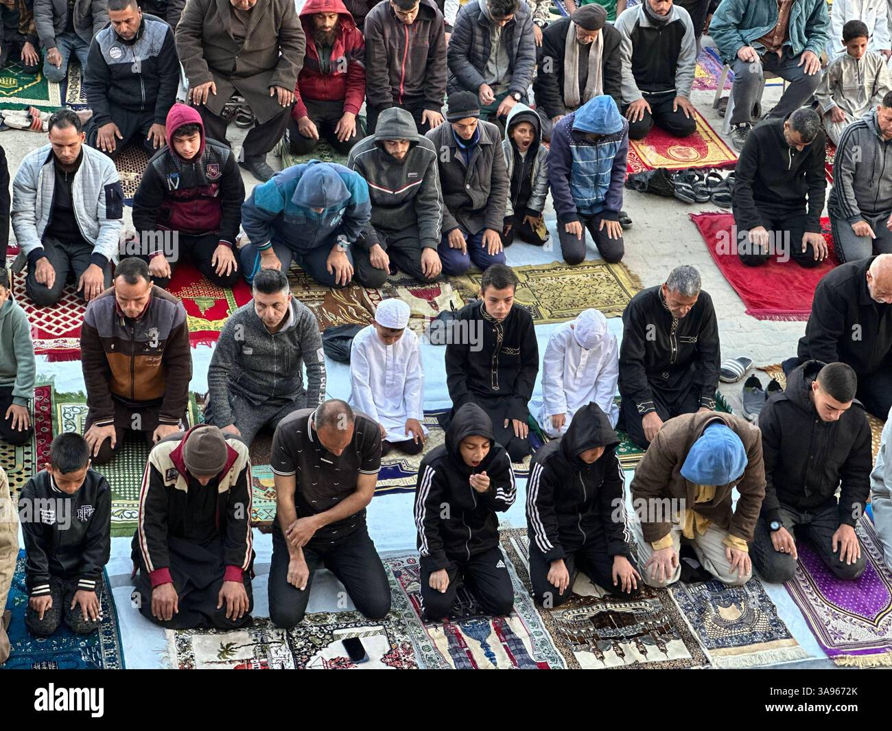 Palestinian Muslims attend Eid al-Fitr prayer marking the end of the ...