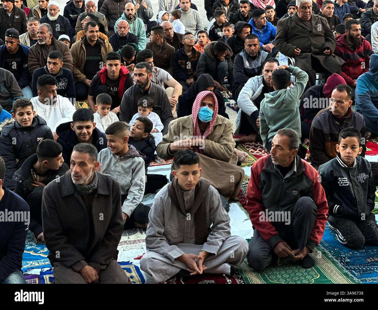 Palestinian Muslims attend Eid al-Fitr prayer marking the end of the ...