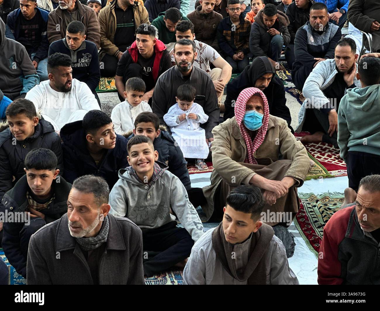 Palestinian Muslims attend Eid al-Fitr prayer marking the end of the ...