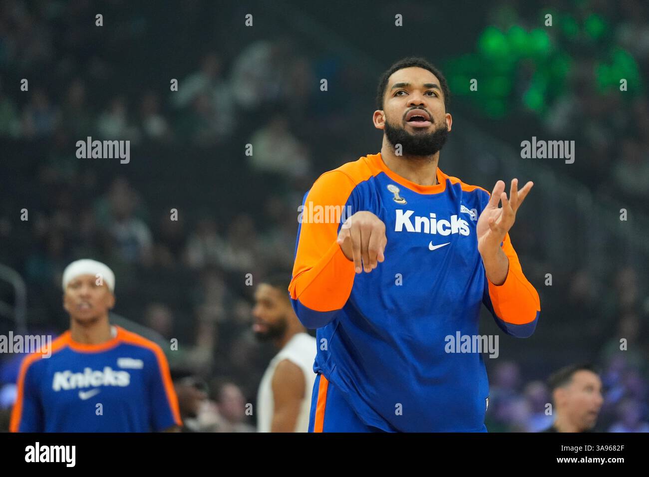 New York Knicks' Karl-Anthony Towns warms up before an NBA basketball ...