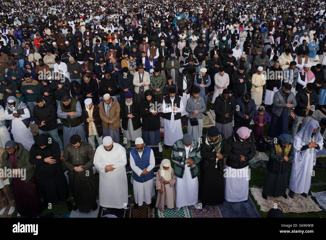 People attend Eid prayers at Small Heath Park in Birmingham as the holy ...