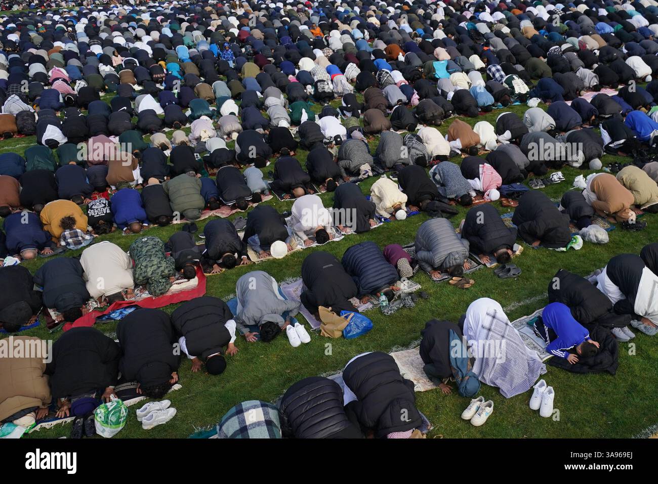 People attend Eid prayers at Small Heath Park in Birmingham as the holy ...