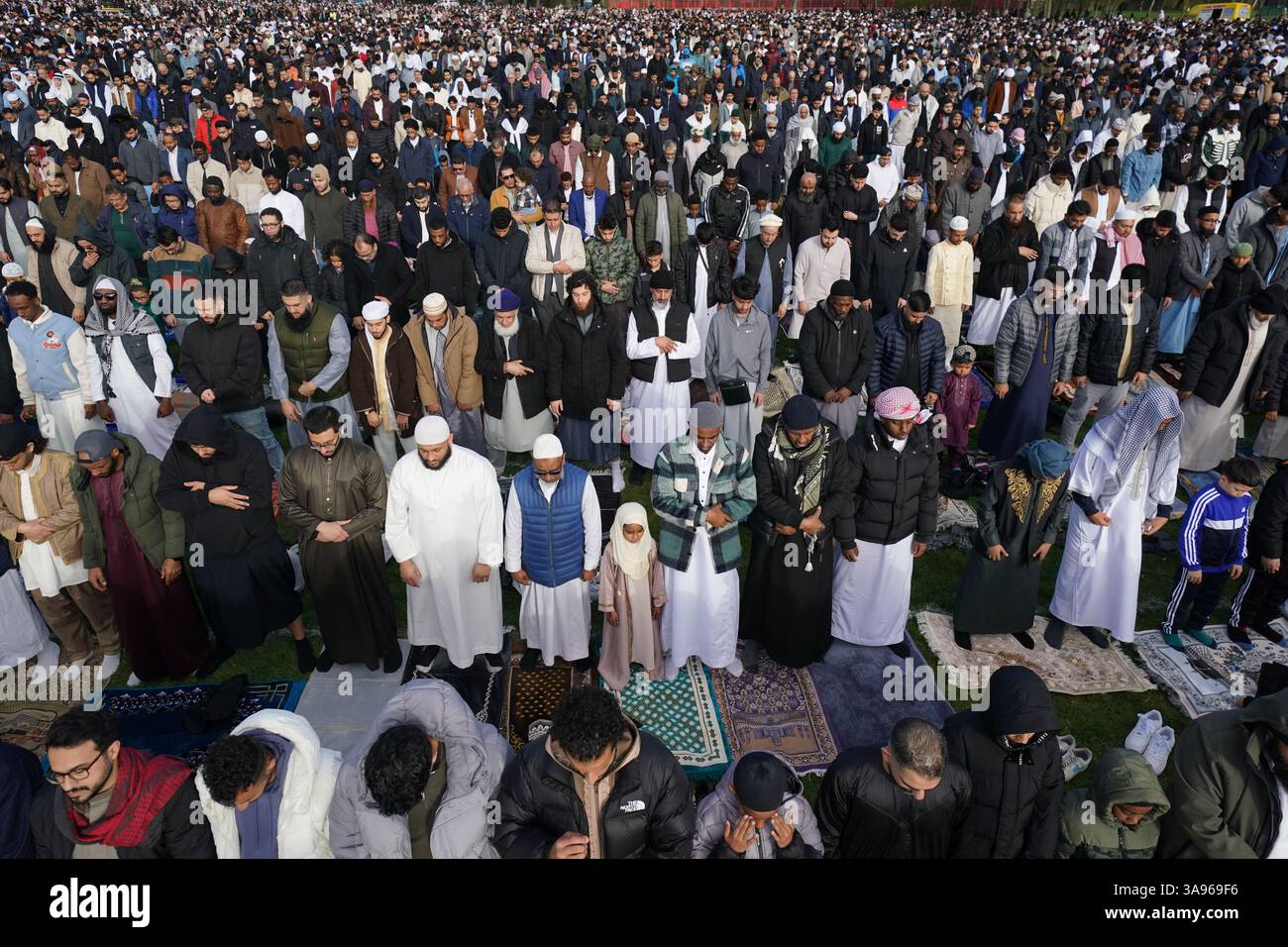 People attend Eid prayers at Small Heath Park in Birmingham as the holy ...