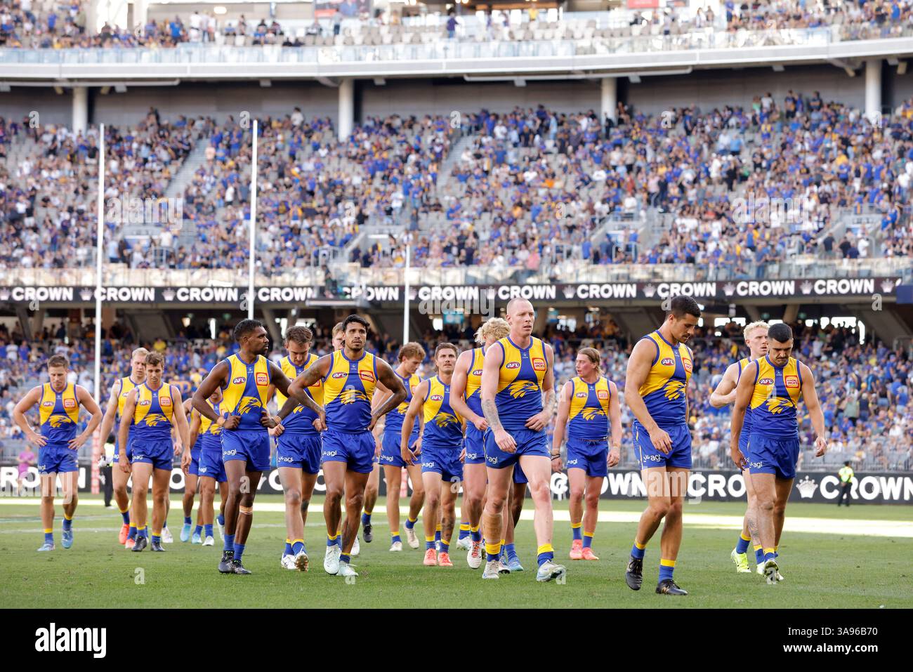 Perth, Australia. 30th Mar, 2025. Eagles players leave the field at ...