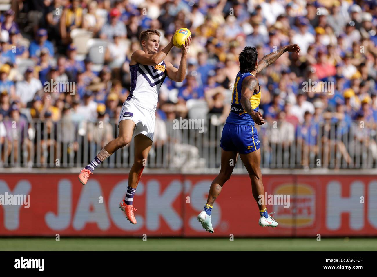 Perth, Australia. 30th Mar, 2025. Jeremy Sharp of the Dockers marks the ...