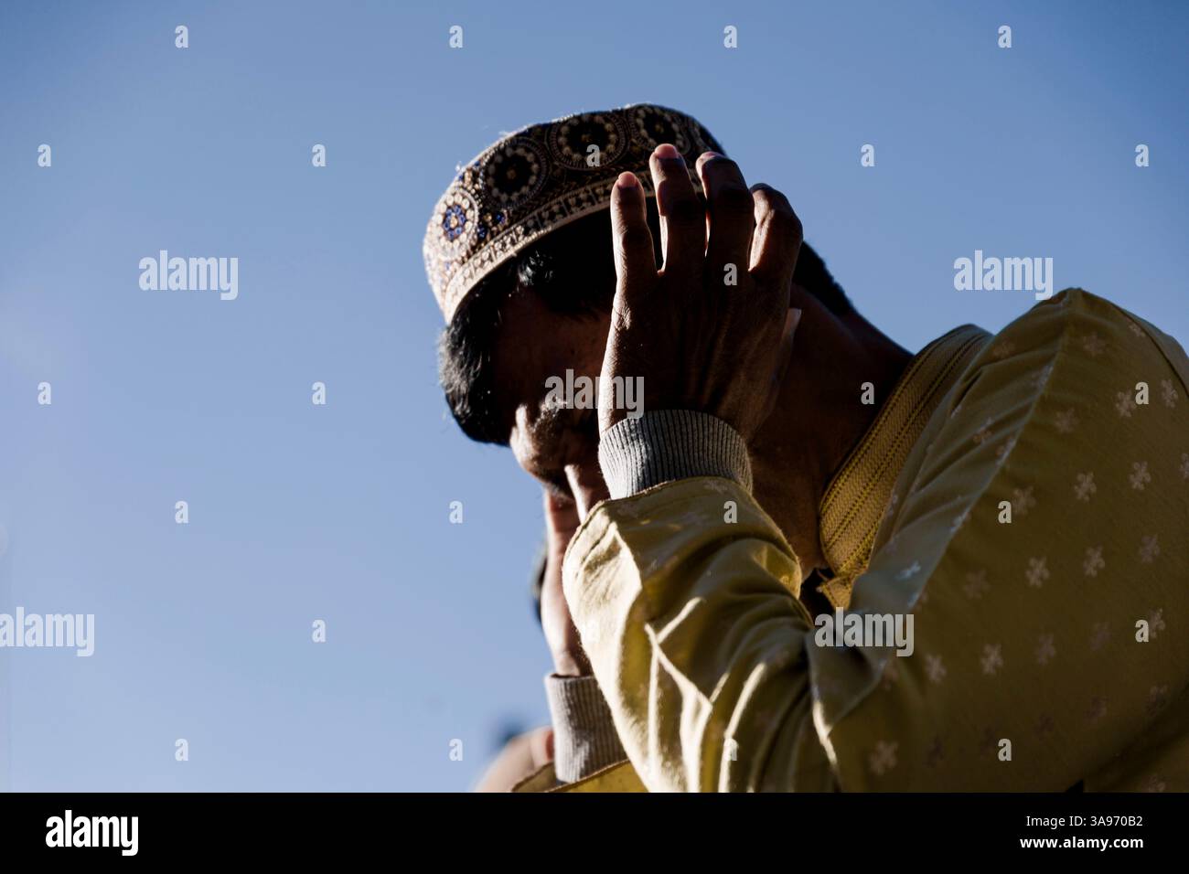 A man prays on the last day of Ramadan at the Casino de la Reina park ...