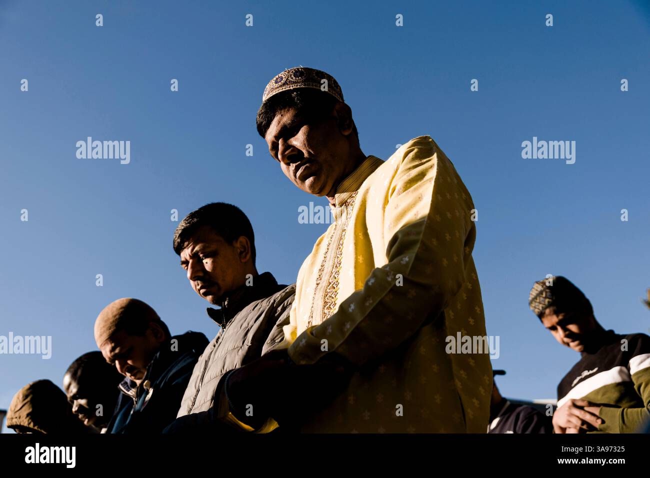 Men pray on the last day of Ramadan at the Casino de la Reina park on ...
