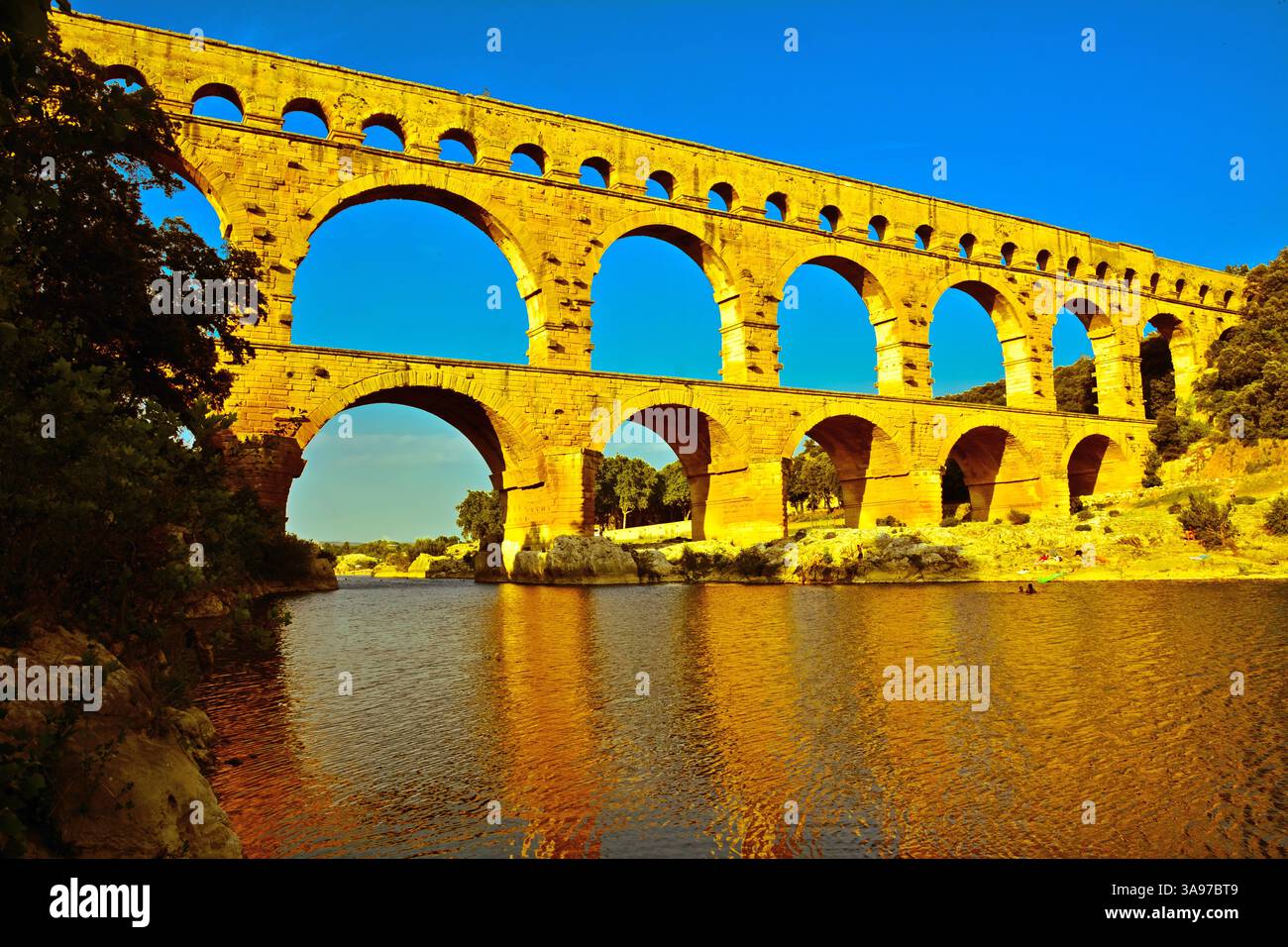 The three-tiered aqueduct of Pont du Gard, an ancient Roman aqueduct ...