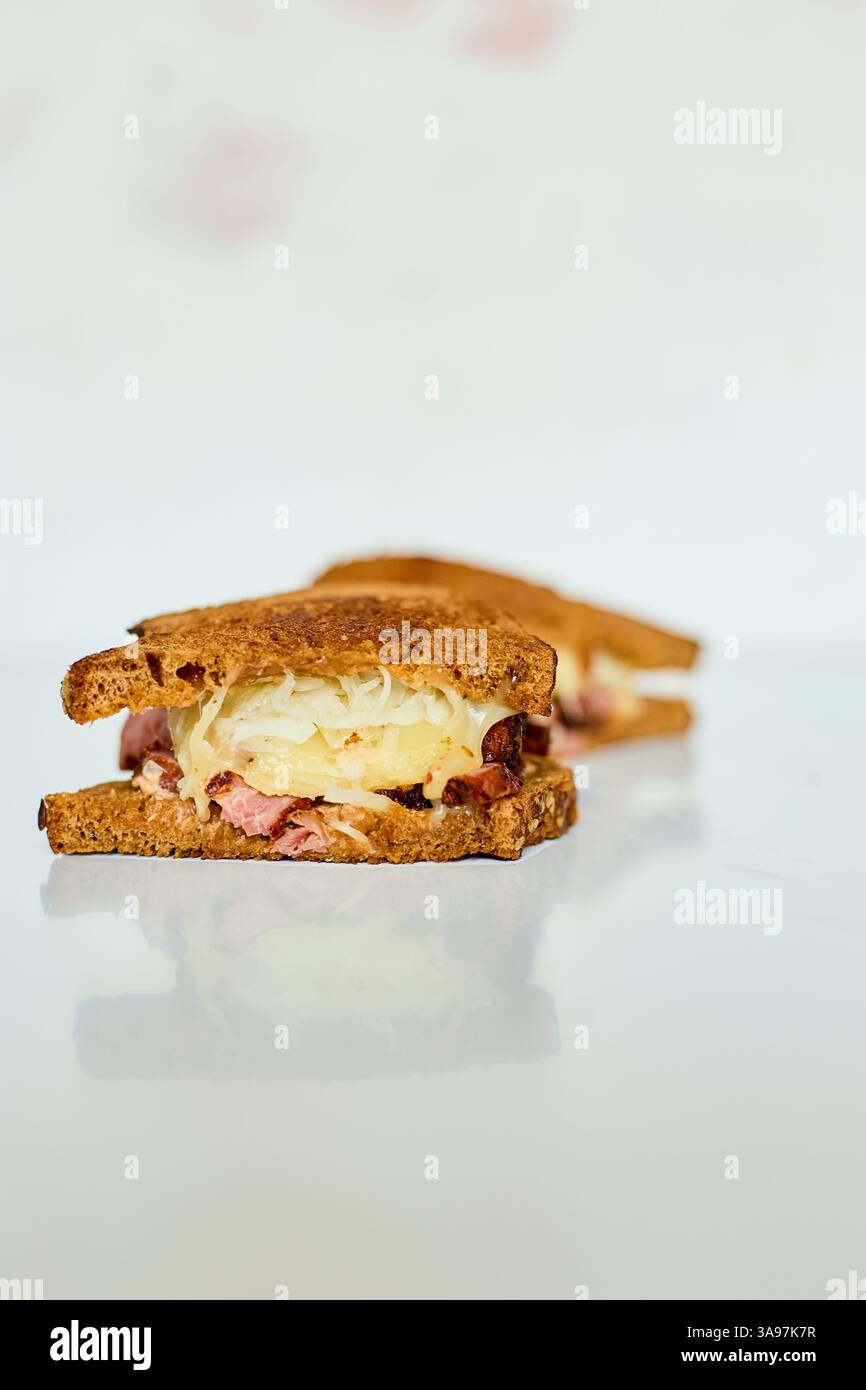 A Reuben sandwich showcases layers of corned beef, sauerkraut, and ...