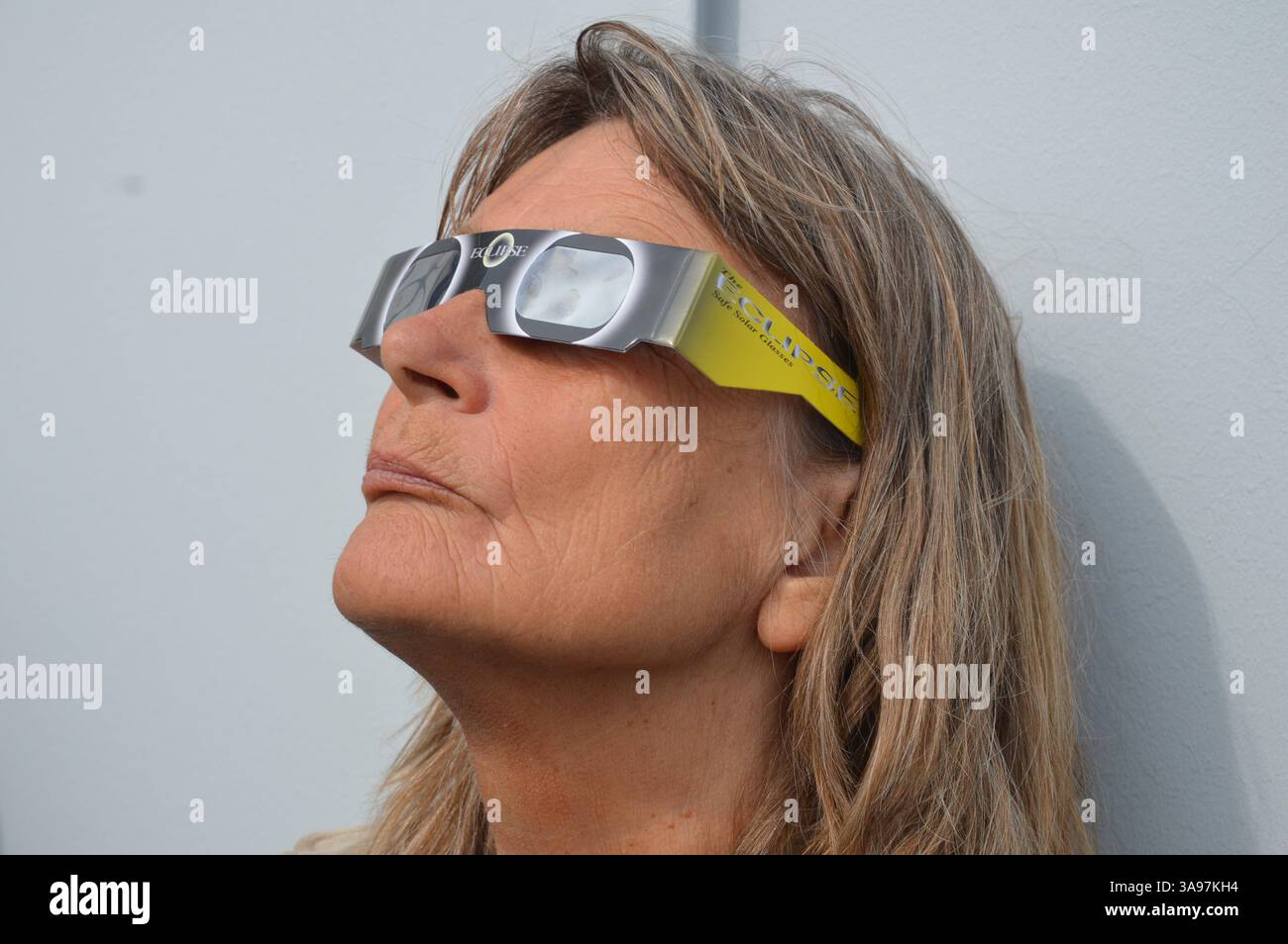 Berlin, Germany - March 28, 2025 - People watching a partial solar ...
