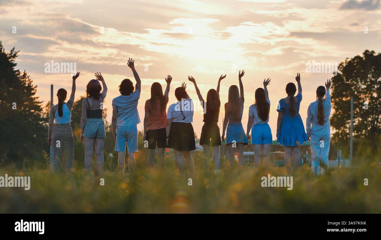 Friends bidding farewell at sunset, marking the happy conclusion of ...