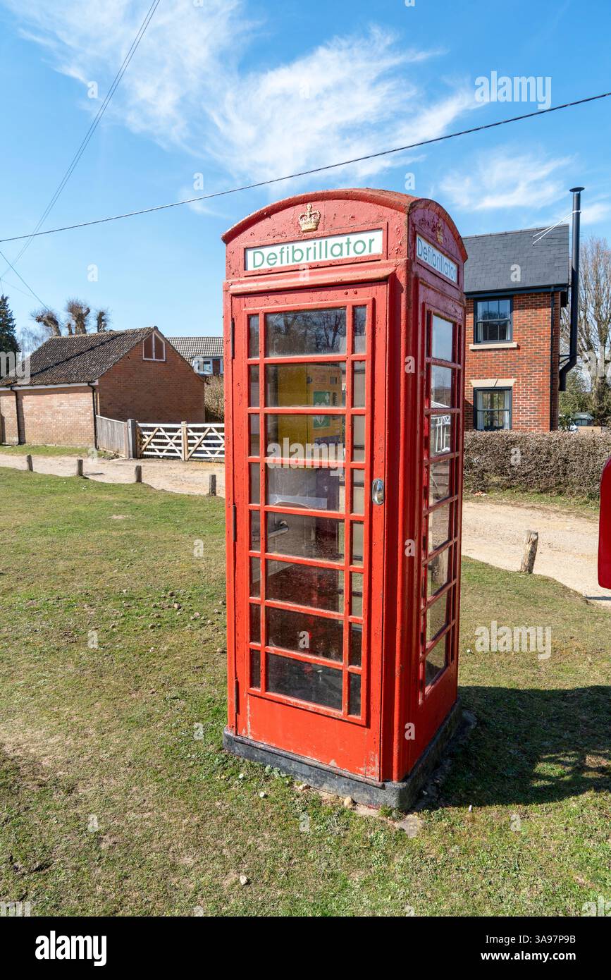 Red telephone box converted to hold defibrillator Stock Photo - Alamy