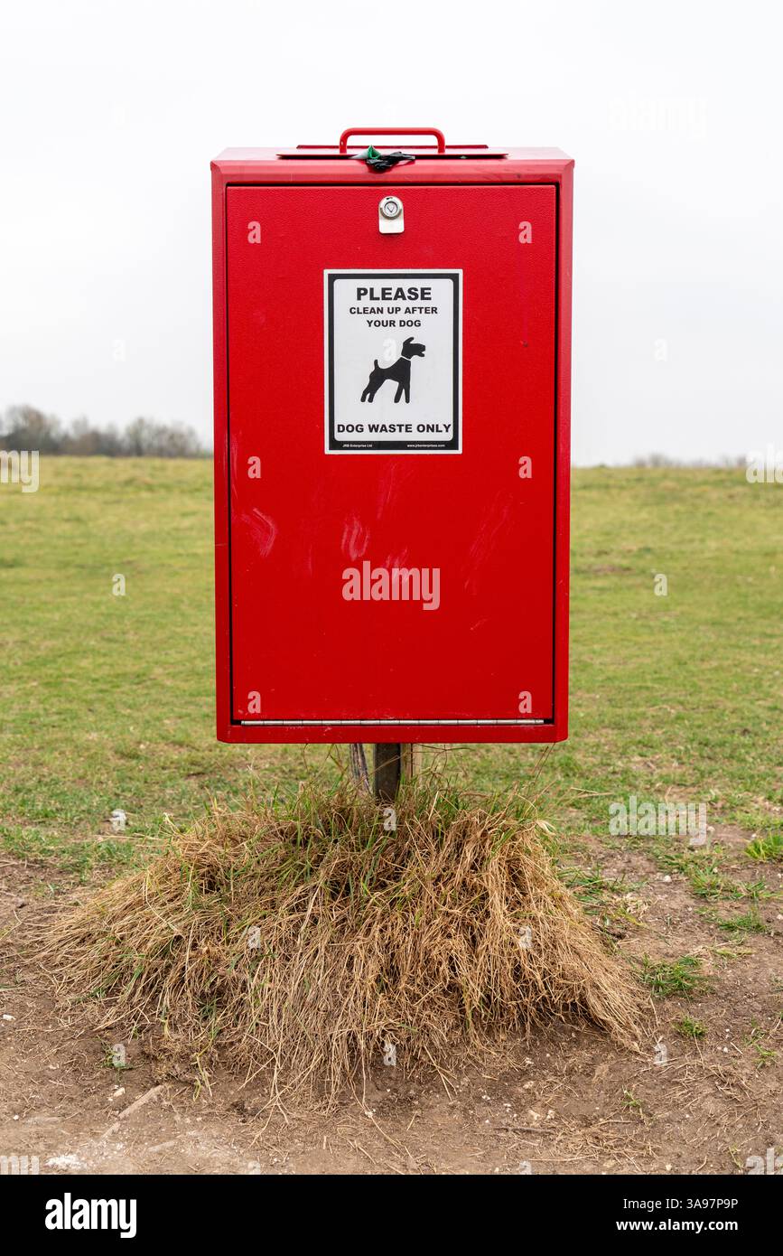 Red metal dog waste disposal bin Stock Photo - Alamy