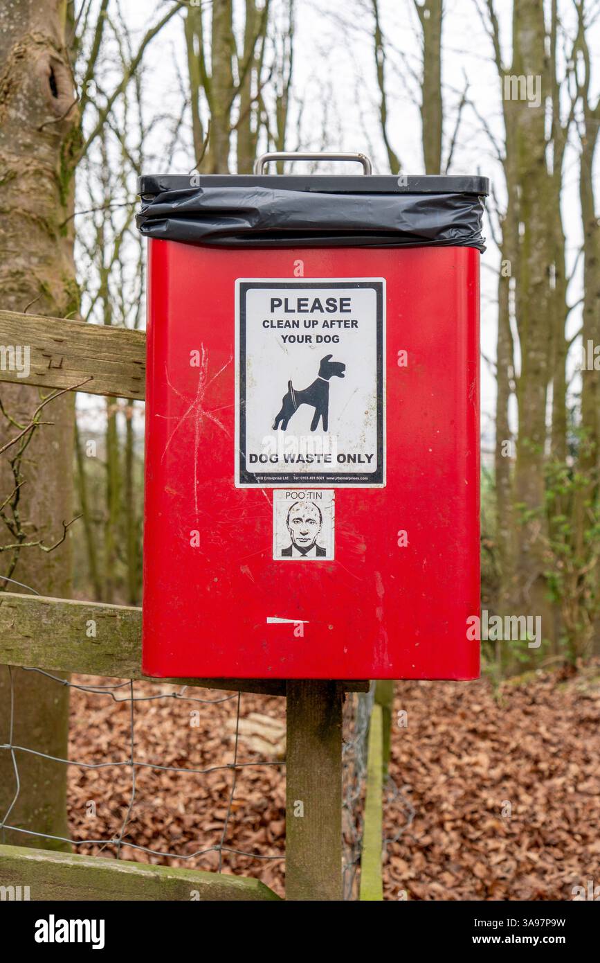 Red metal dog waste disposal bin with a picture of Vladimir Putin Stock ...