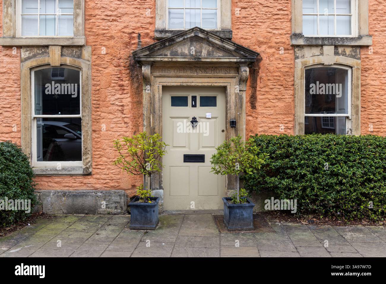 The front door, porch and windows of The Old Bank House a painted ...