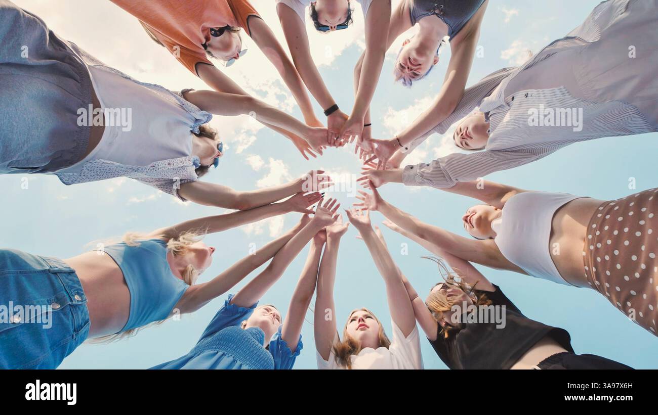 School friends coming together in a circle, representing their unity ...