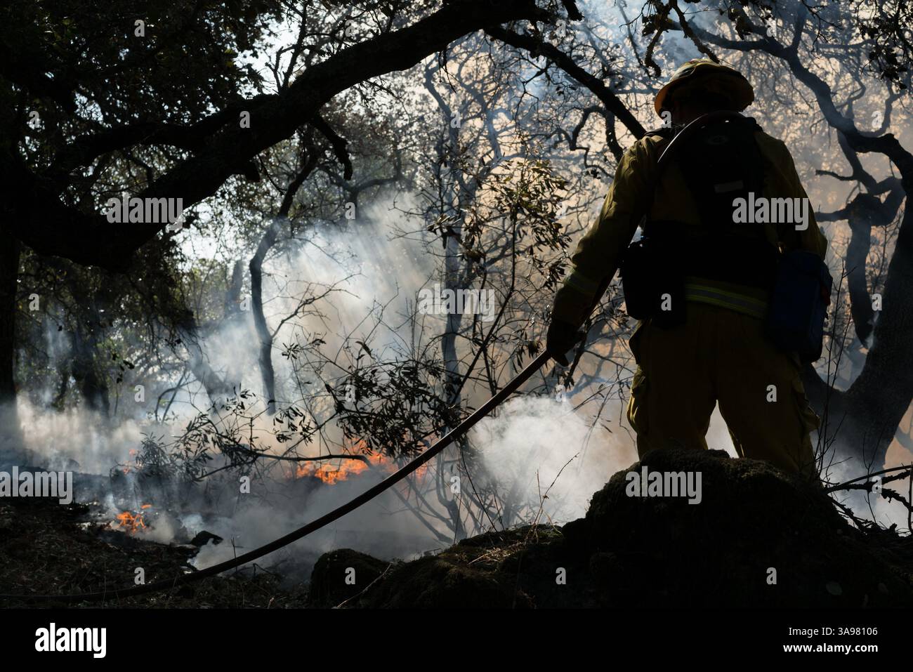 October 14, 2017 - Fire crews work to battle the Nunn fire on October ...