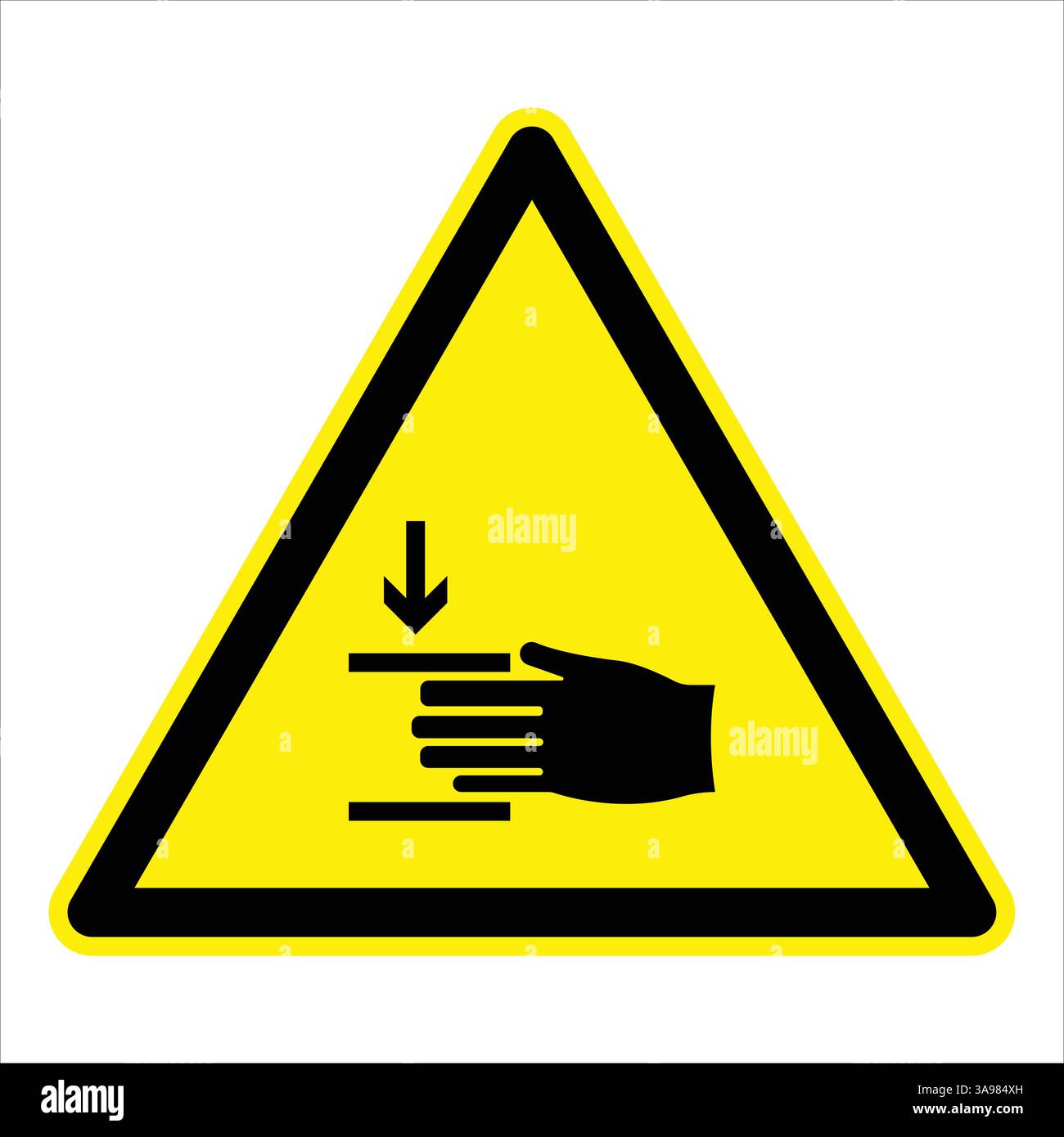 Yellow triangular warning sign indicating a hand crushing hazard ...