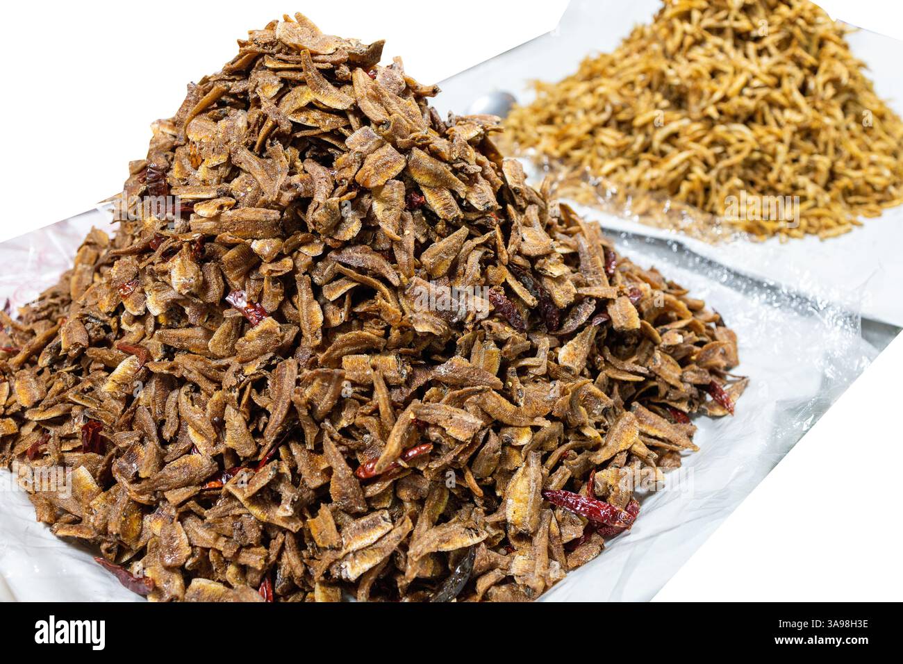 Die cut of crispy fried anchovy fish with salt on white isolated Stock ...
