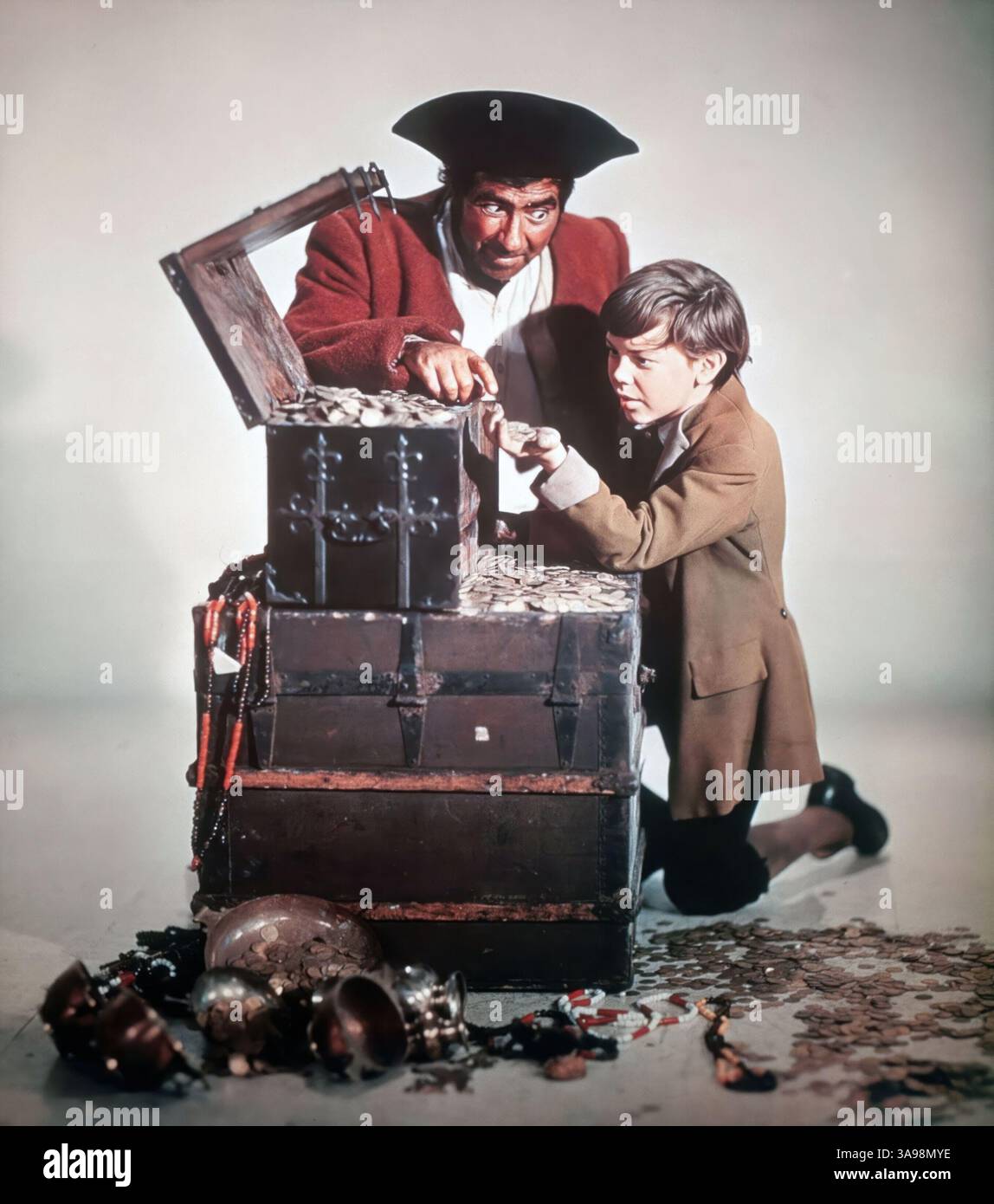 BOBBY DRISCOLL and ROBERT NEWTON in TREASURE ISLAND (1950), directed by BYRON HASKIN. Credit ...
