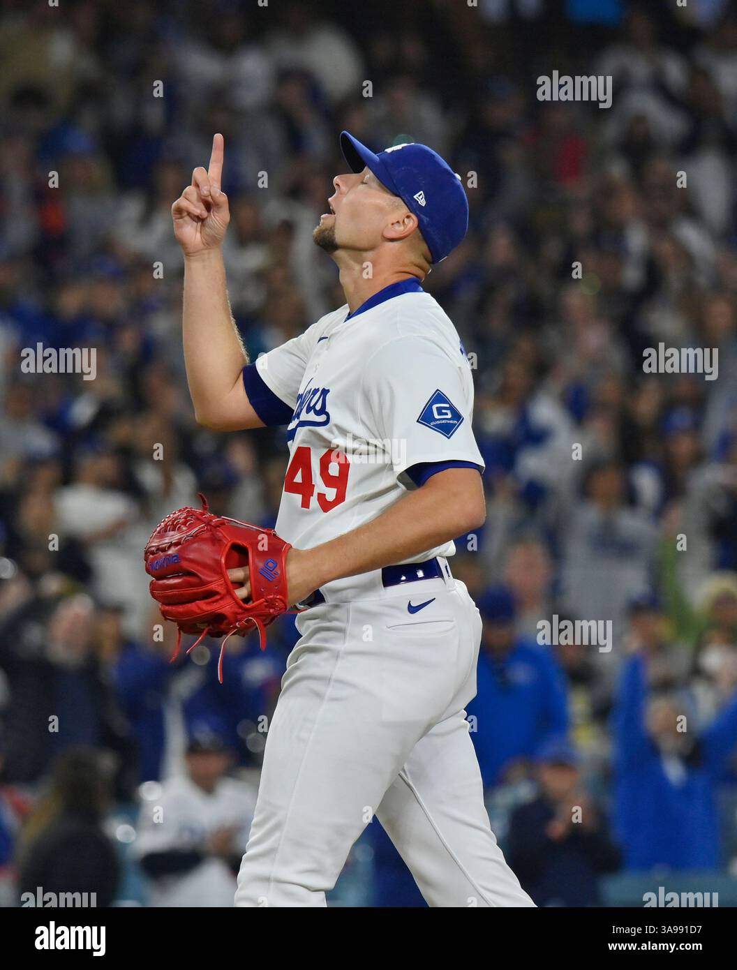 Los Angeles Dodgers pitcher Blake Treinen reacts after recording the ...