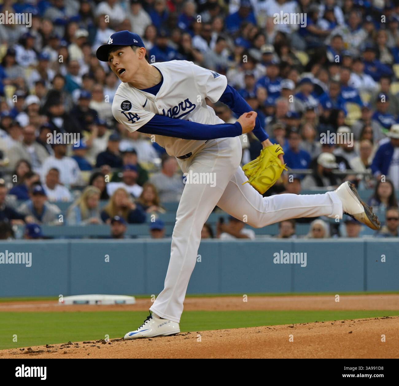 Los Angeles Dodgers starting pitcher Roki Sasak delivers in the second ...
